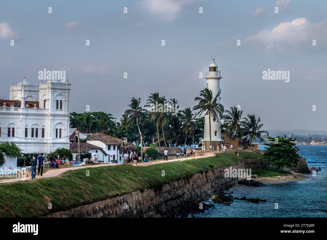 Aerial view of a traditional lighthouse with a tall tower perched atop ...