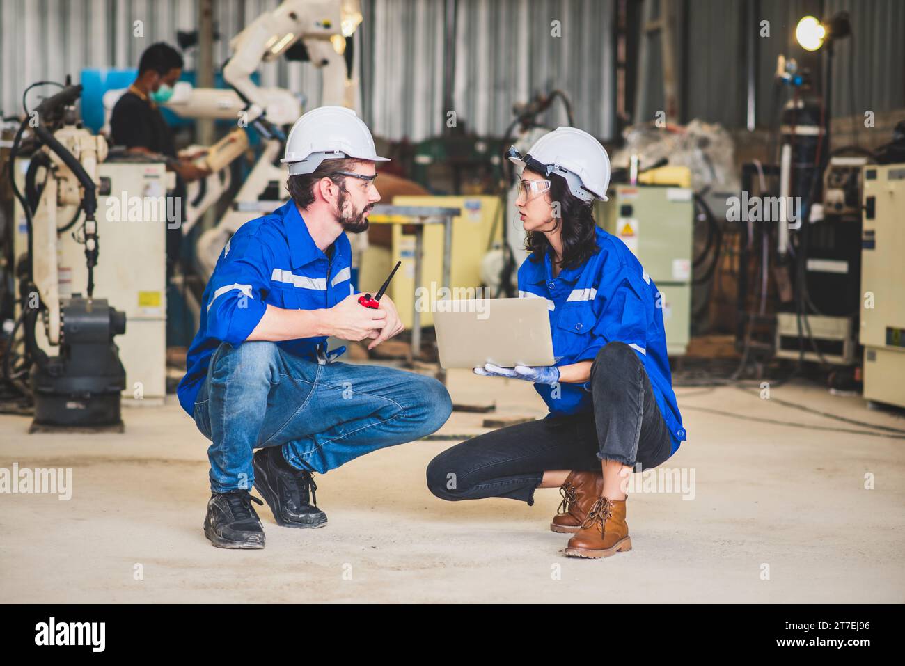Engineers team mechanic using computer controller Robotic arm for ...
