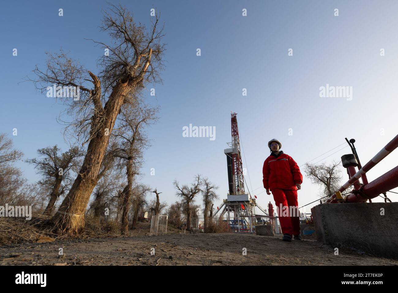 Kuqa. 15th Nov, 2023. A staff member patrols at the site of the Yuejin ...