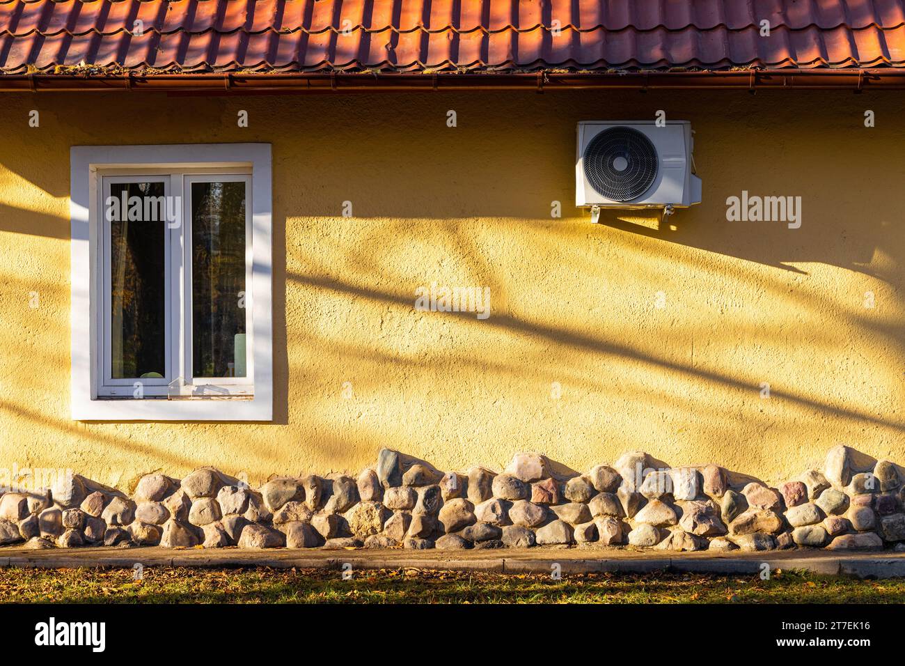 external air conditioner unit on the wall of the house. house facade ...