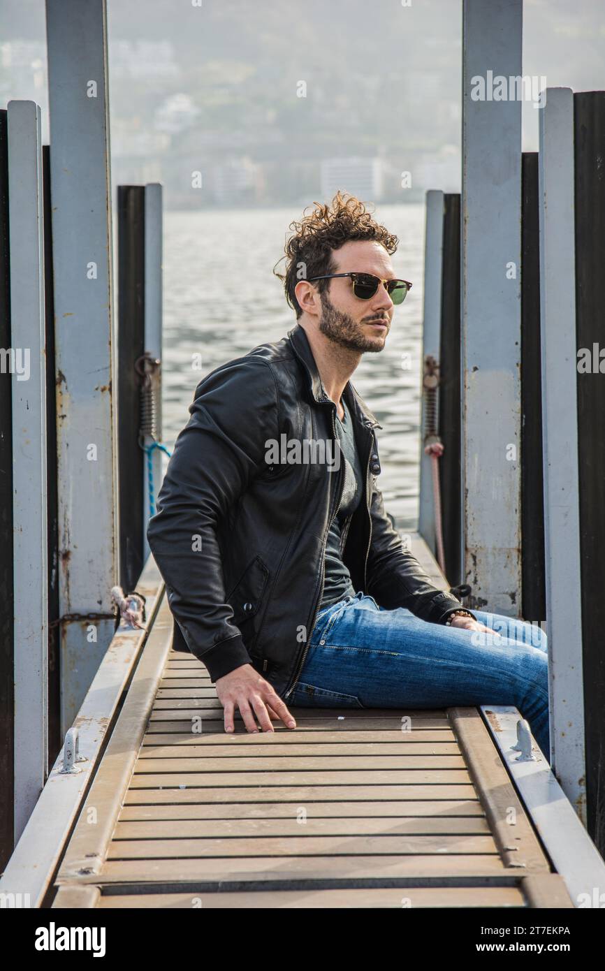 Man sitting on dock hi-res stock photography and images - Alamy