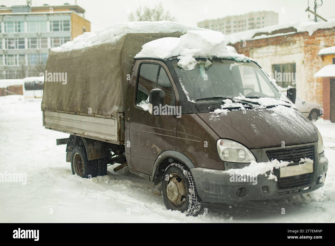 Freight transport in snow. Russian truck. Gray body of machine ...