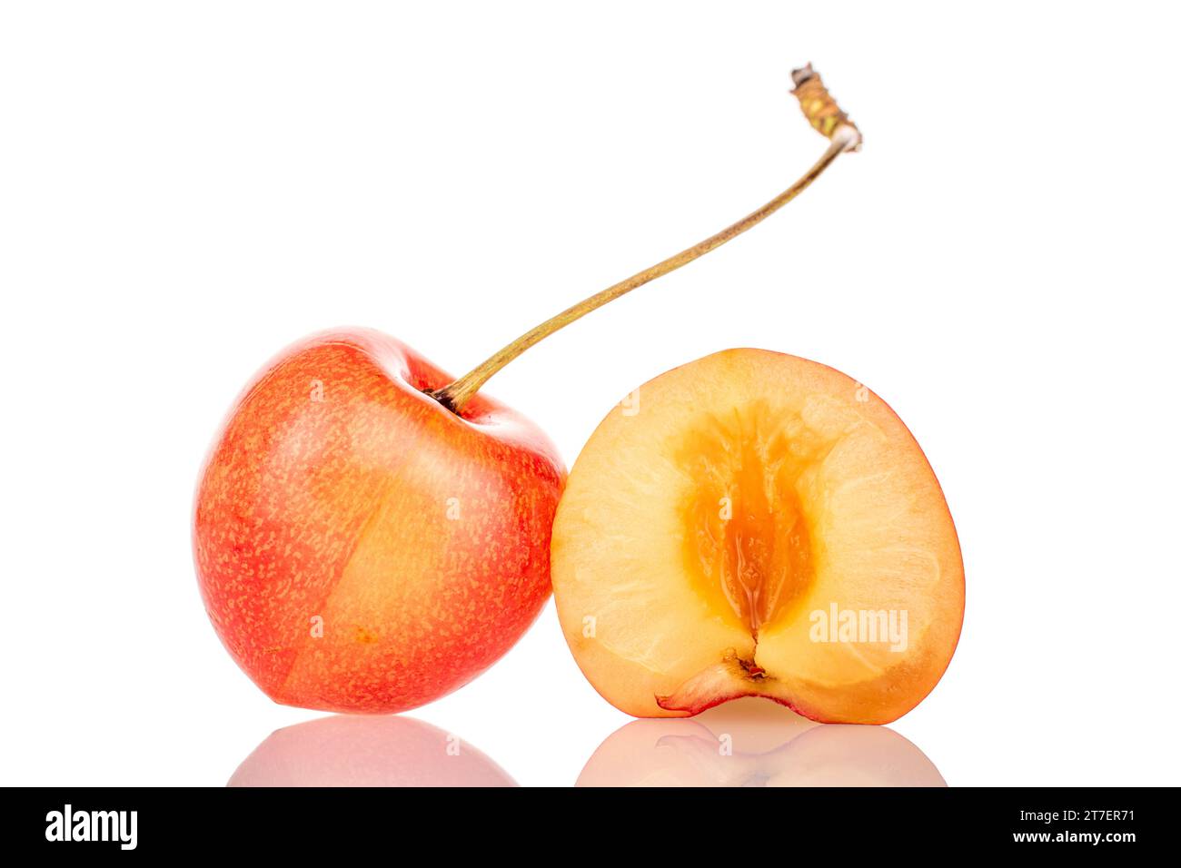 One whole sweet cherry berry and one half, macro, isolated on white ...