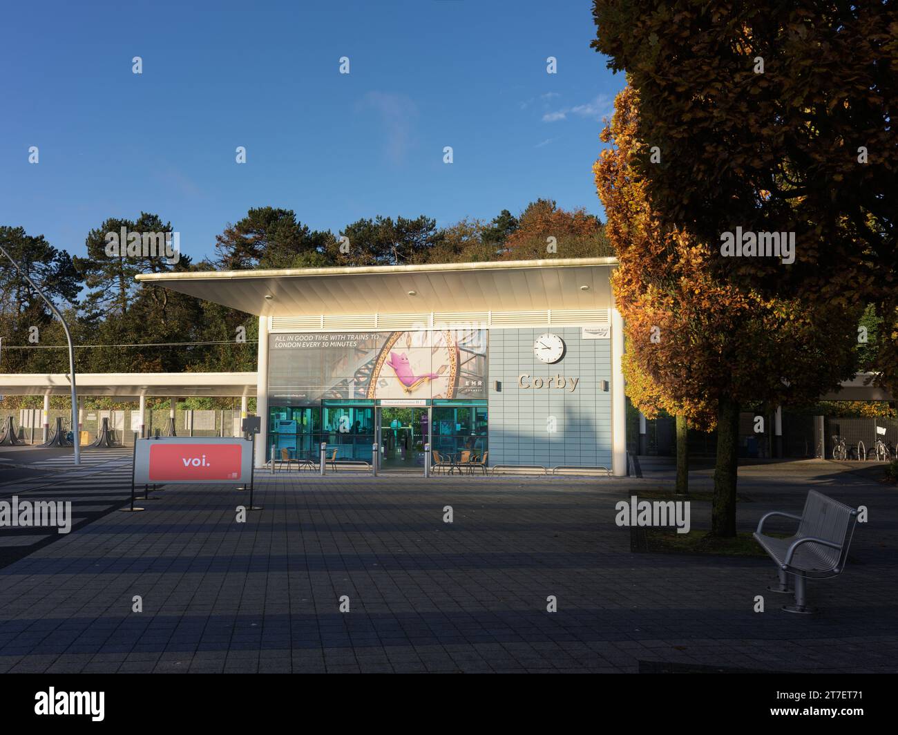 The sunlit ticket office and waiting room at Corby railway station ...