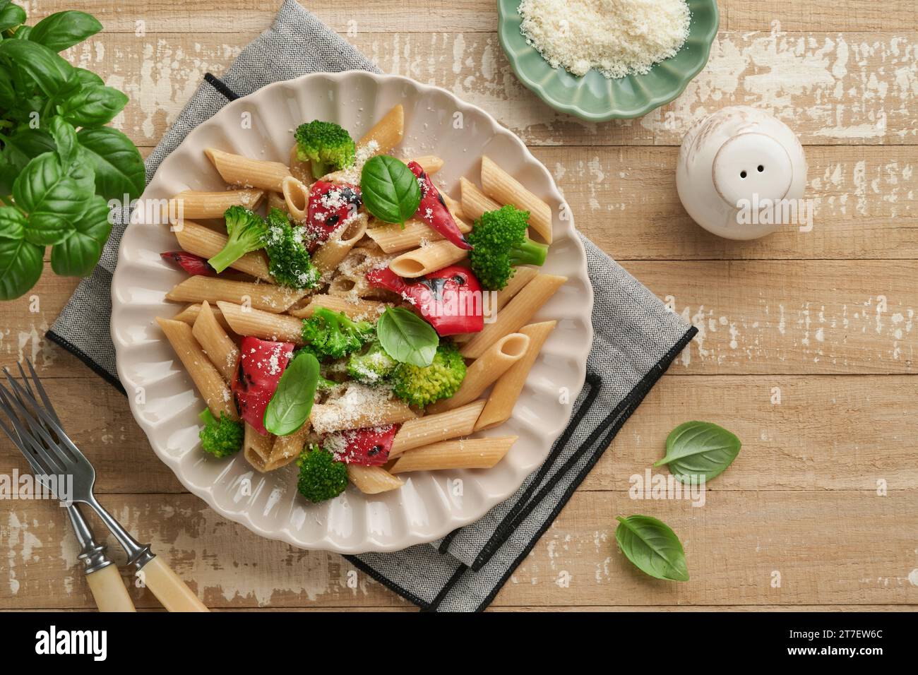 Wholegrain pasta penne with broccoli and red grilled bell pepper and on ...