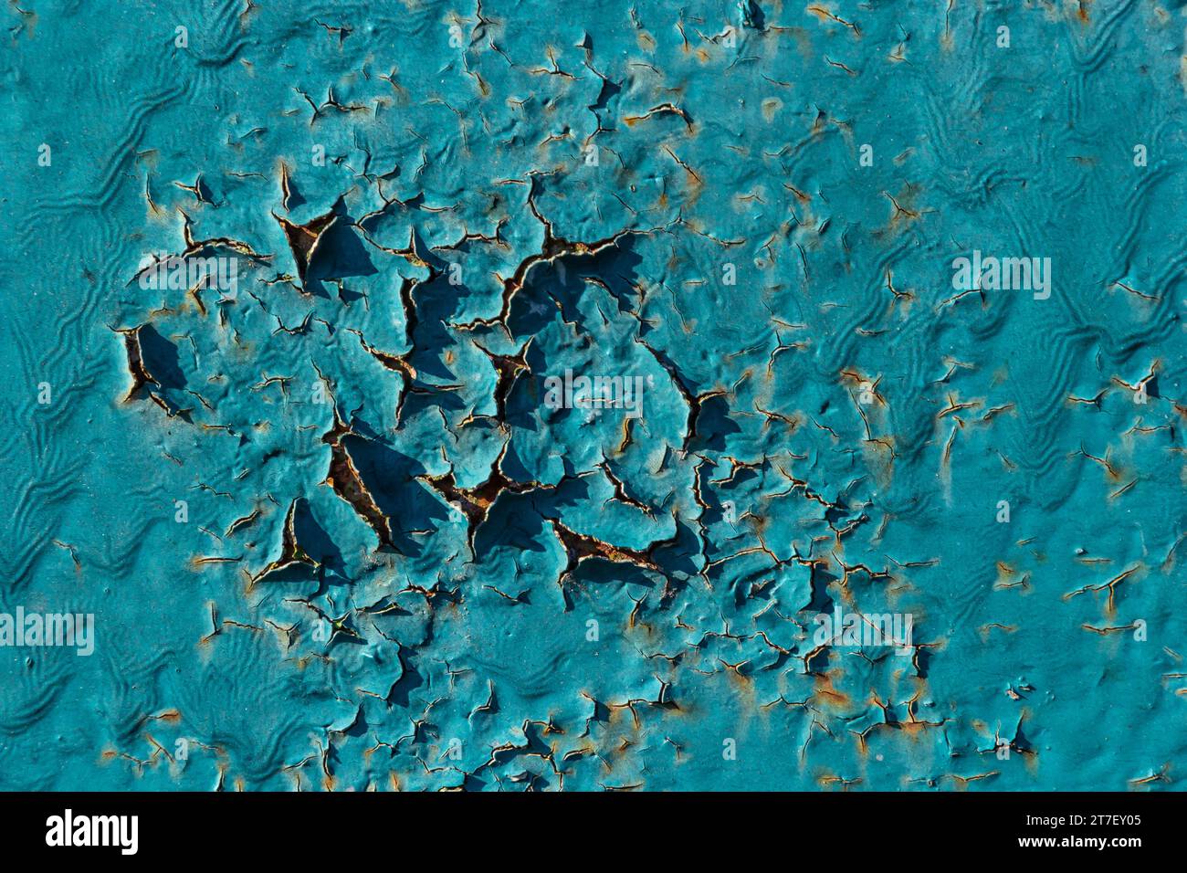 Blue peeling paint on the wall. Old concrete wall with cracked flaking ...