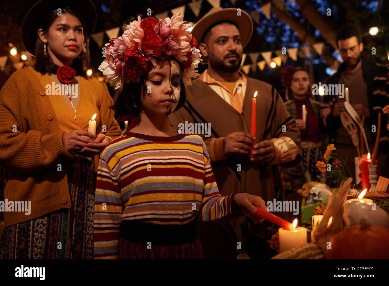 Group of people lighting candles and celebrating the day of dead people ...