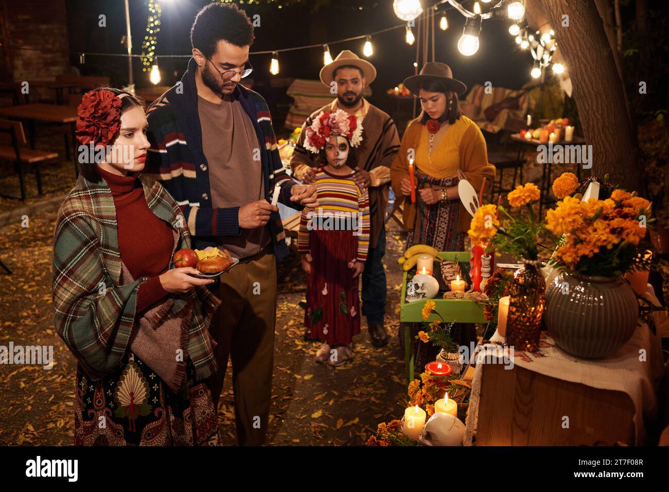 Big family in traditional clothes remembering their dead relatives ...