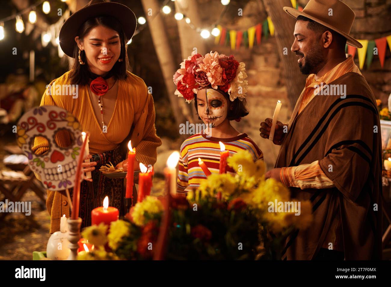 Family celebrating the mexican holiday together, they standing with ...