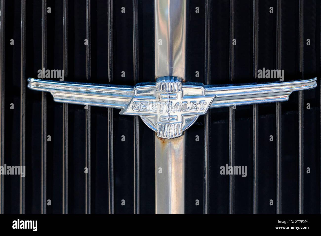 chrome chevrolet badge on grille of vintage car Stock Photo - Alamy