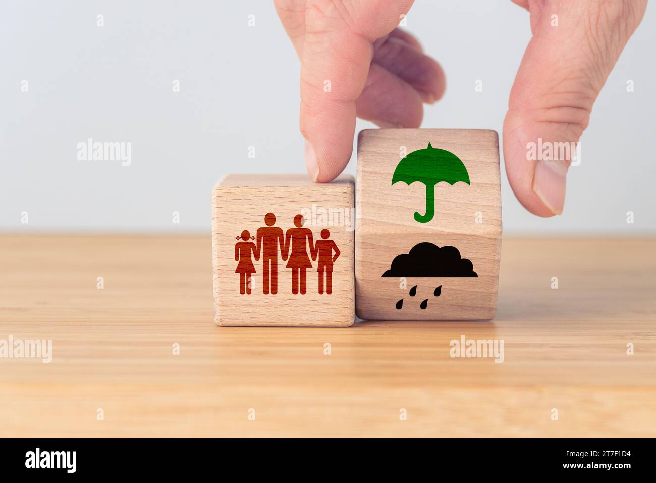 happy family, helping hand turns a block with a rainy black cloud and ...