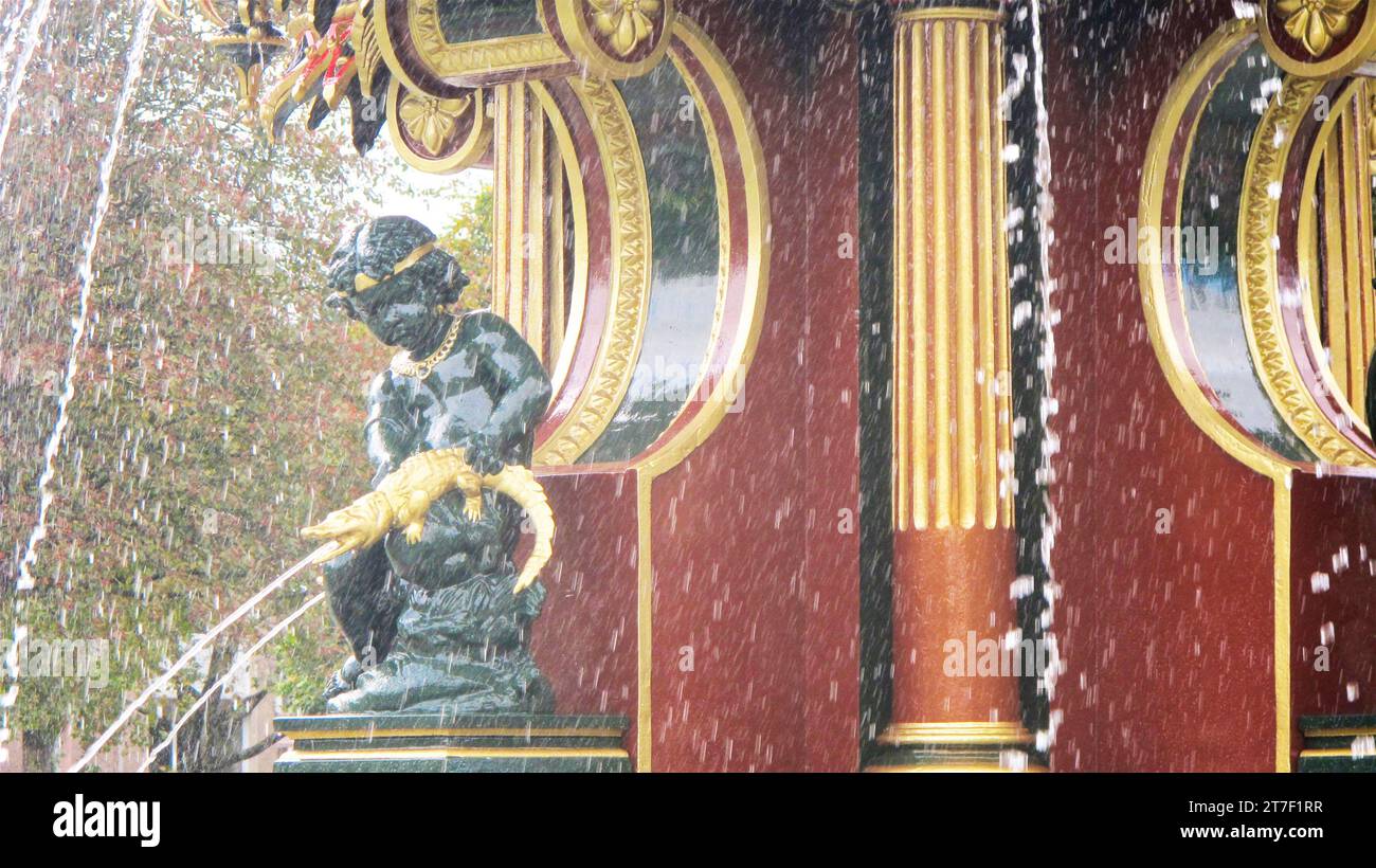 pixie feature water fountain holding golden crocodile with flowing jets ...