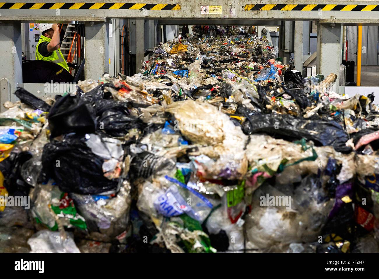 Plastic waste runs on conveyor belts at a new plastic waste sorting ...