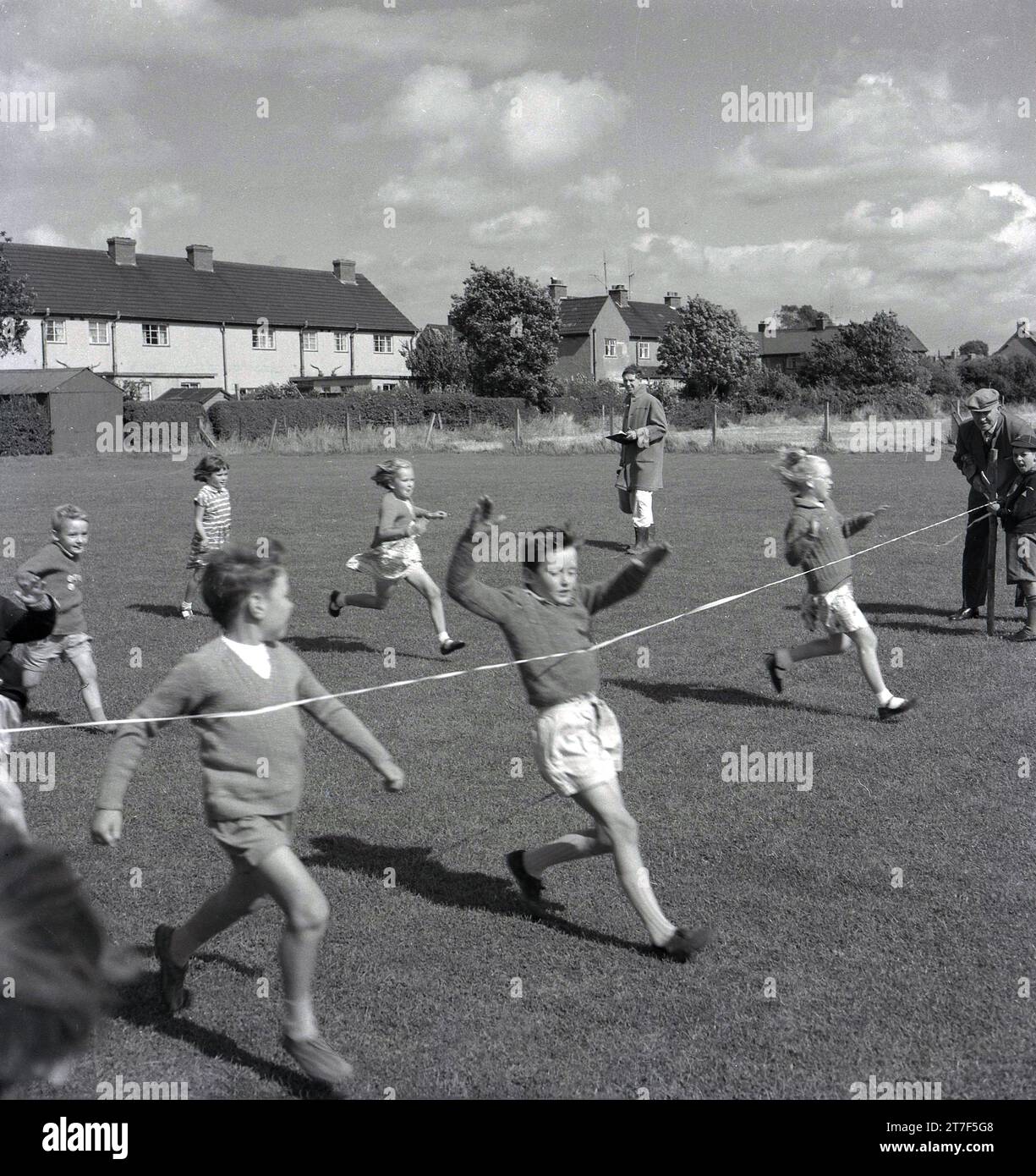 1960s, historical, school sports day, primary school children competing ...