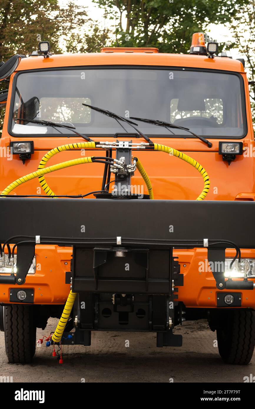 Close-up of the cab of an orange-colored truck Stock Photo - Alamy