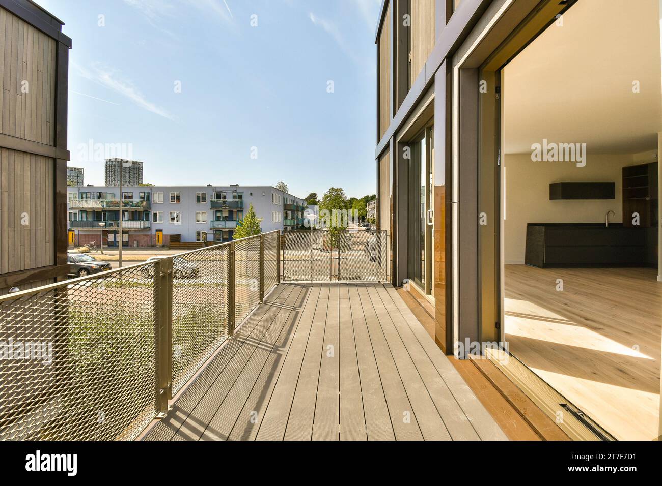 an outside area with wood and metal railings on the side of a building ...