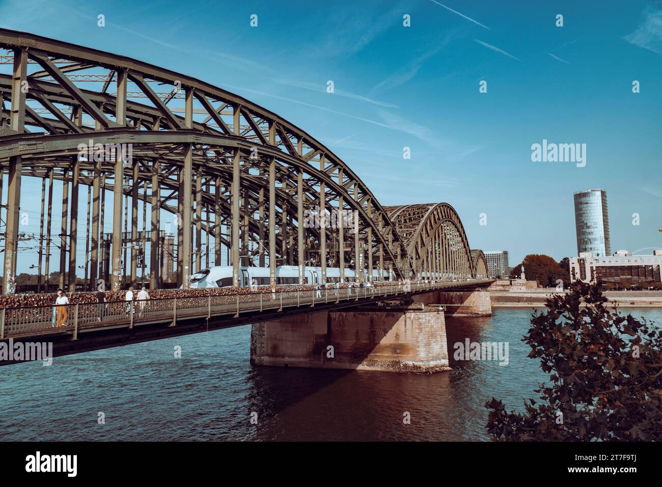 The Hohenzollern Bridge is a bridge crossing the river Rhine in the ...