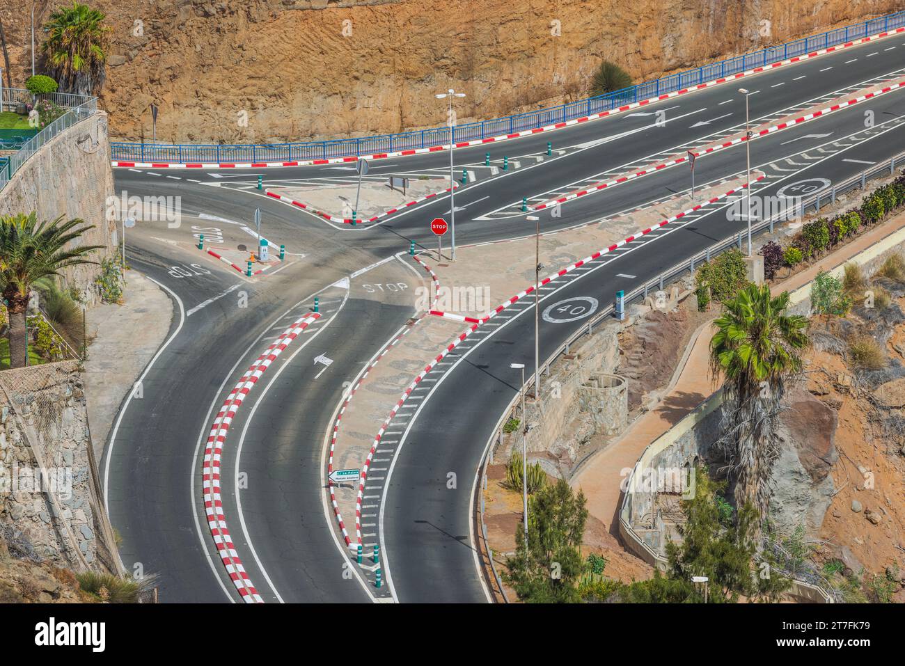 Top view of complex road interchange in mountainous terrain ...