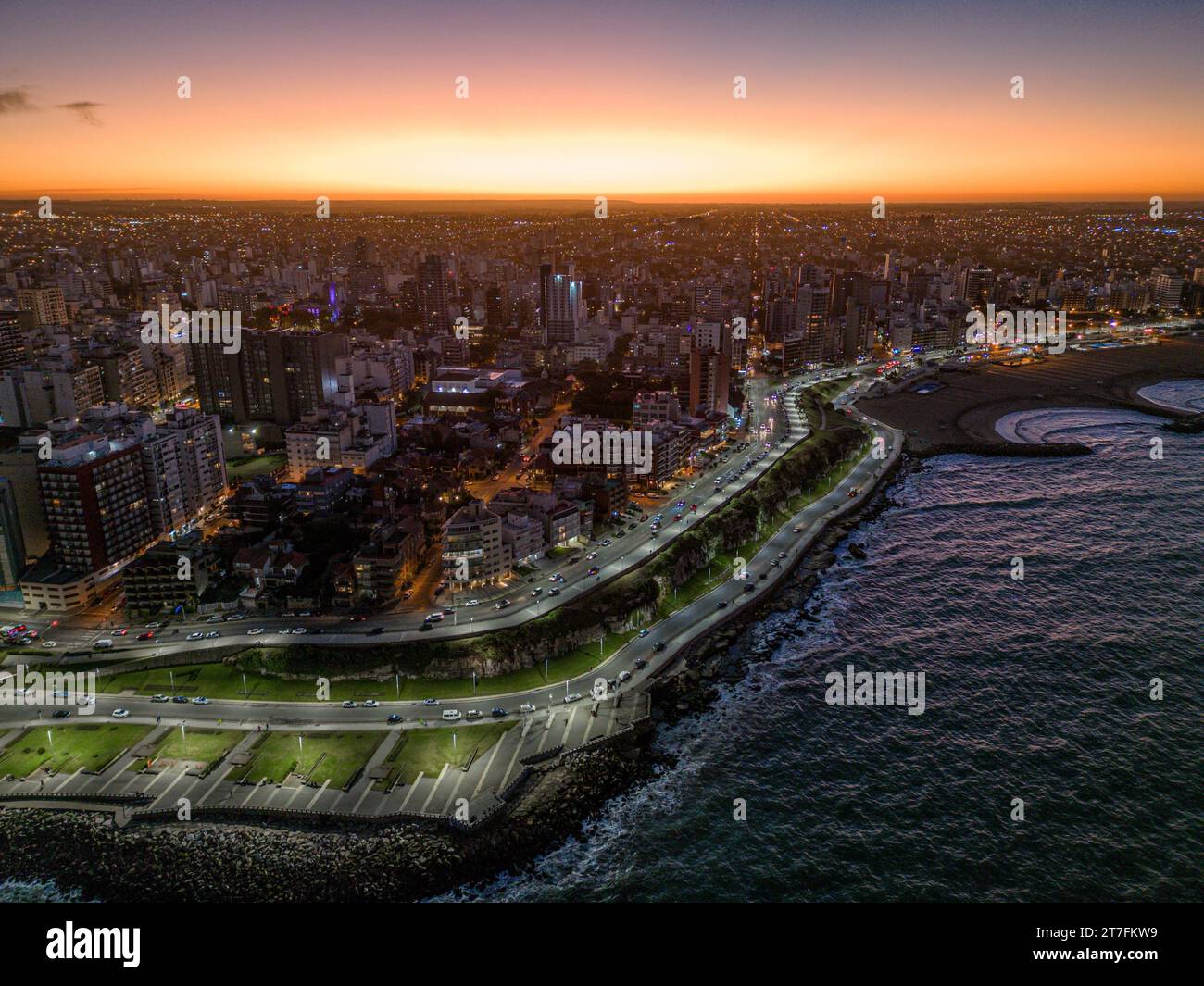 A stunning dusk shot of a metropolitan cityscape featuring a large ...