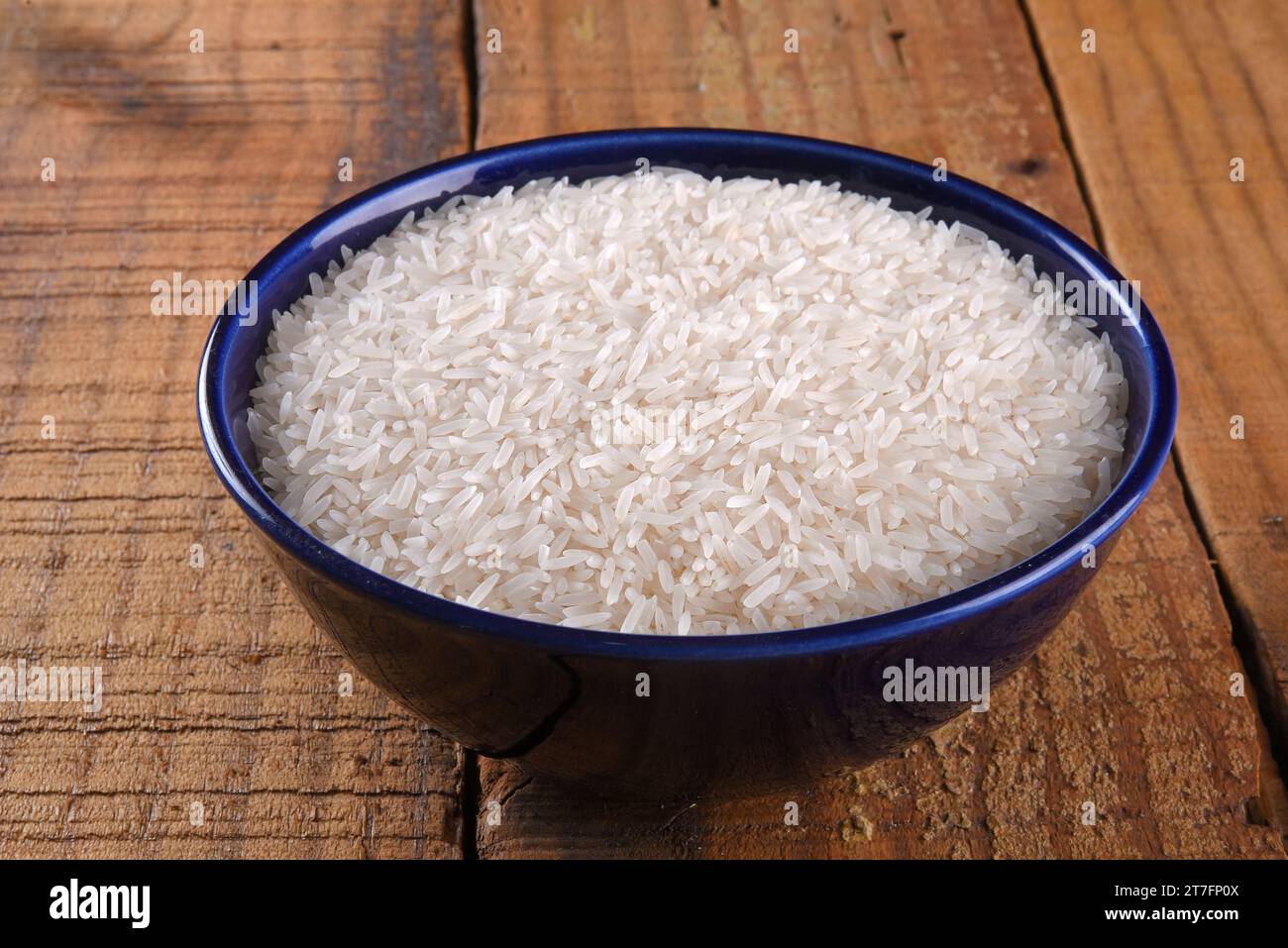 white rice natural long rice grain in porcelain bowl use texture ...