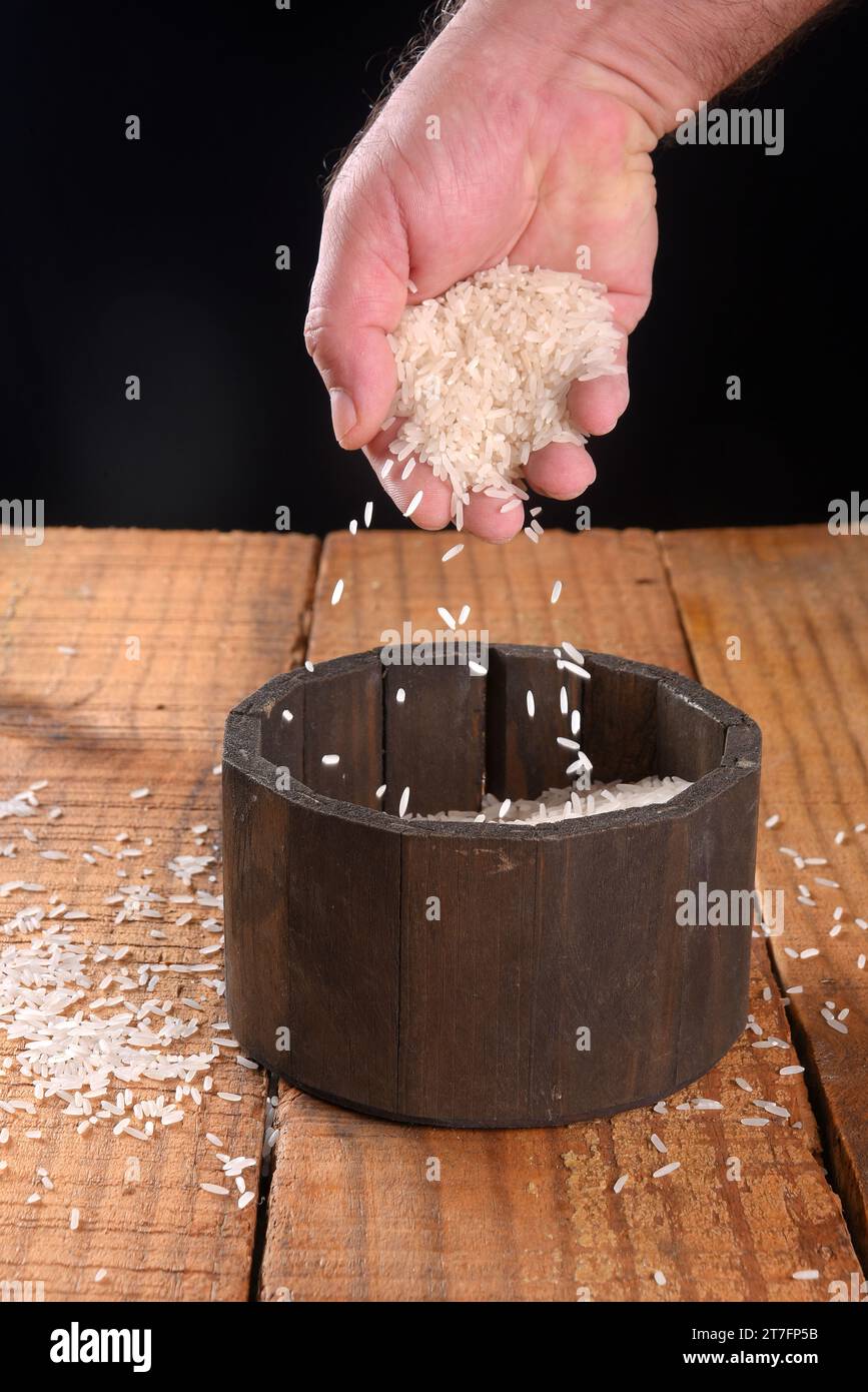 white rice natural long rice grain in wooden bowl use texture ...