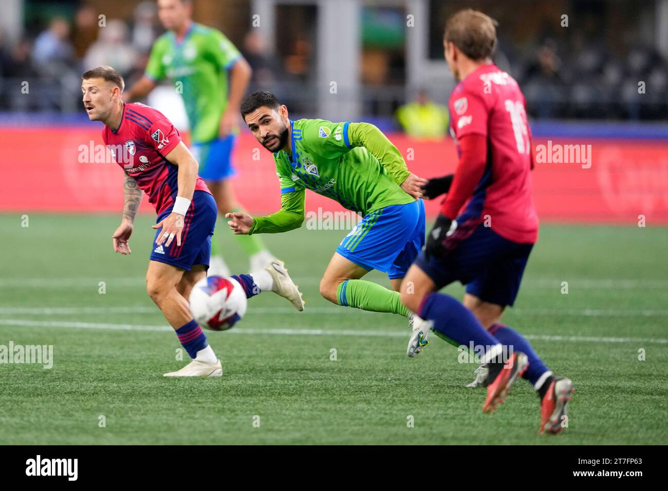Seattle Sounders defender Alex Roldan, center, looks to intercept the ...