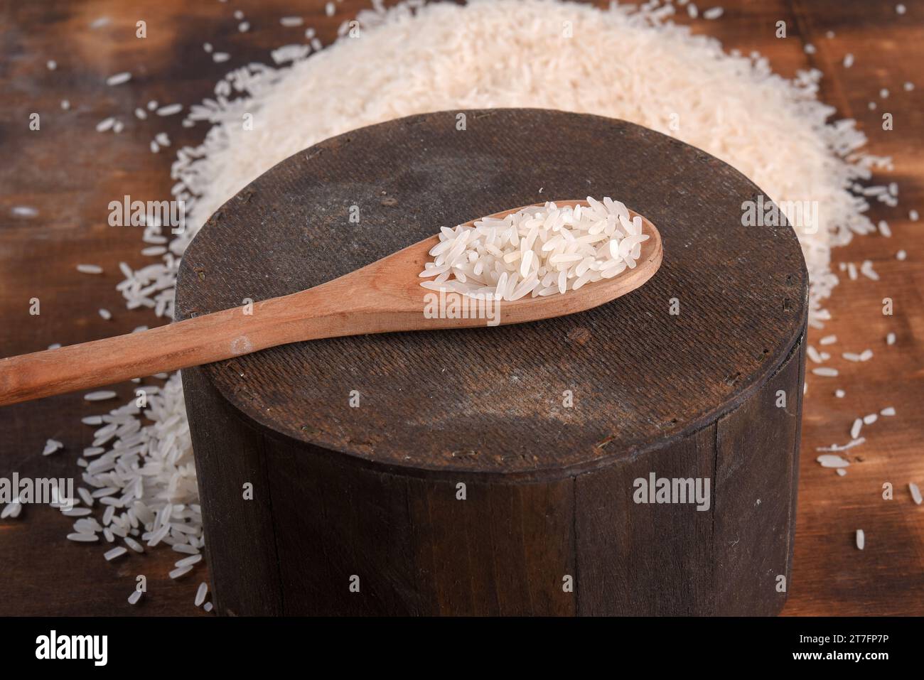white rice natural long rice grain uncooked healthy food wooden table ...