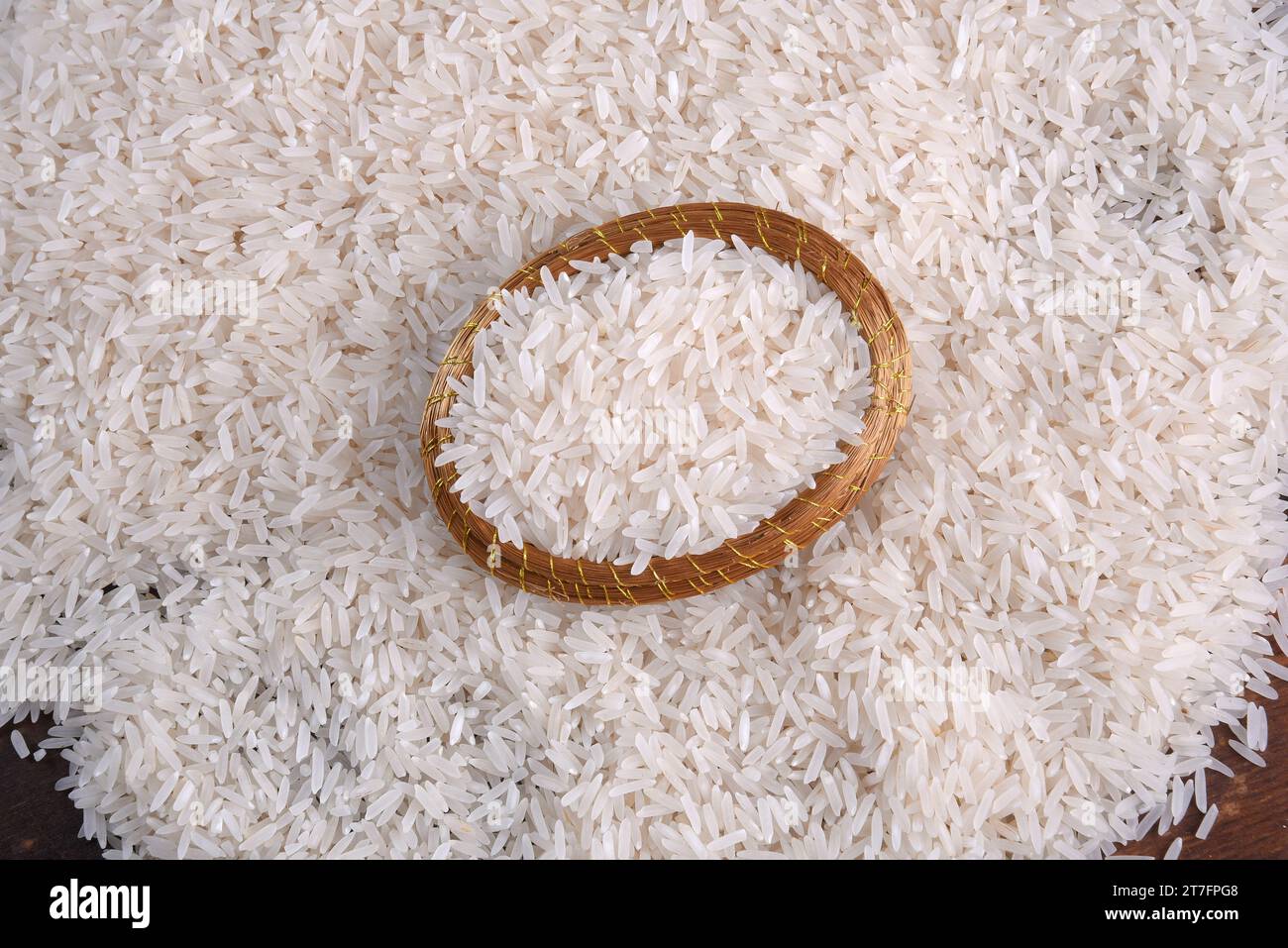 white rice natural long rice grain uncooked healthy food wooden table ...
