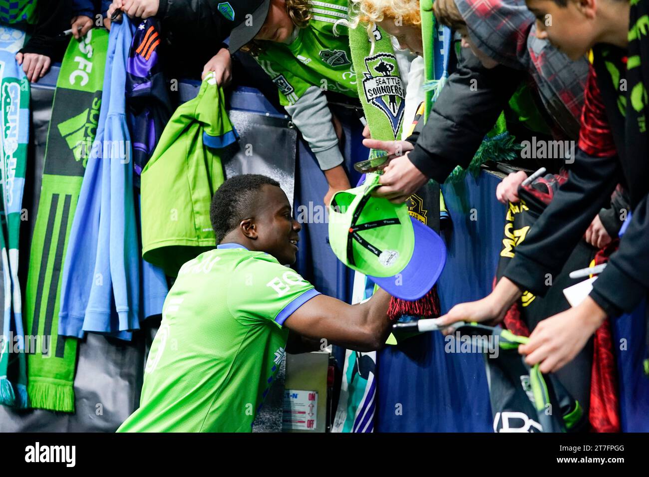 Seattle Sounders defender Nouhou Tolo signs autographs after a 1-0 win ...