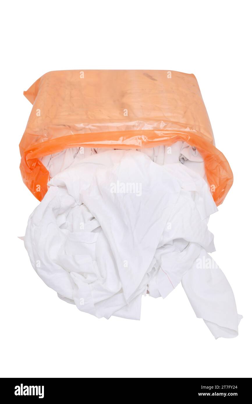 industrial sized orange plastic bag holding large quantity of cloths ...