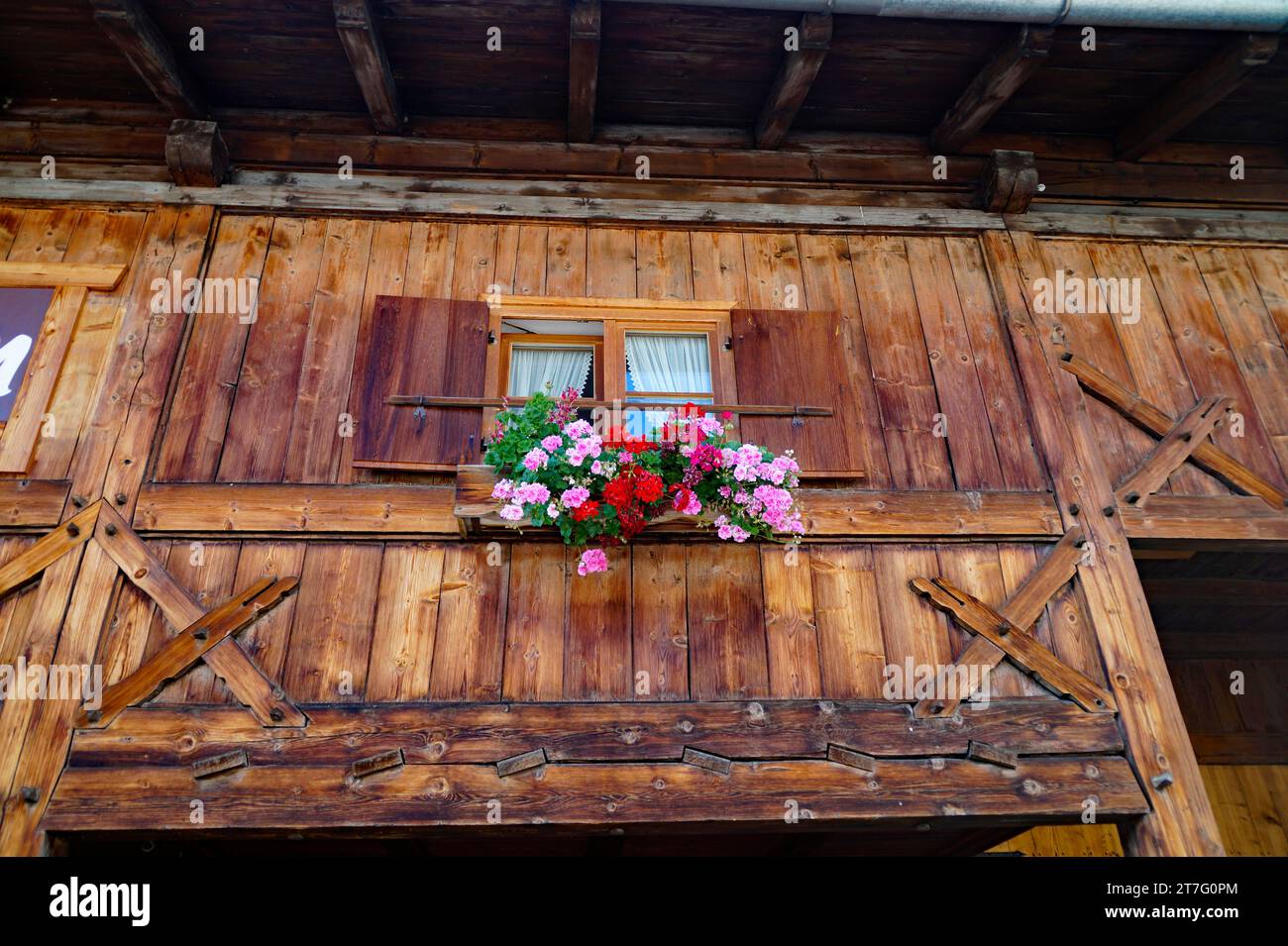 idyllic scene with a traditional Bavarian rustic alpine farmhouse with ...