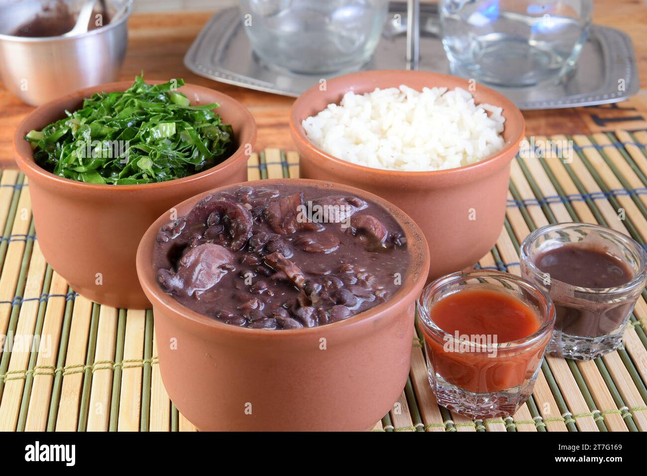 delicious Brazilian food feijoada with beans, pork, bacon, sausage with ...