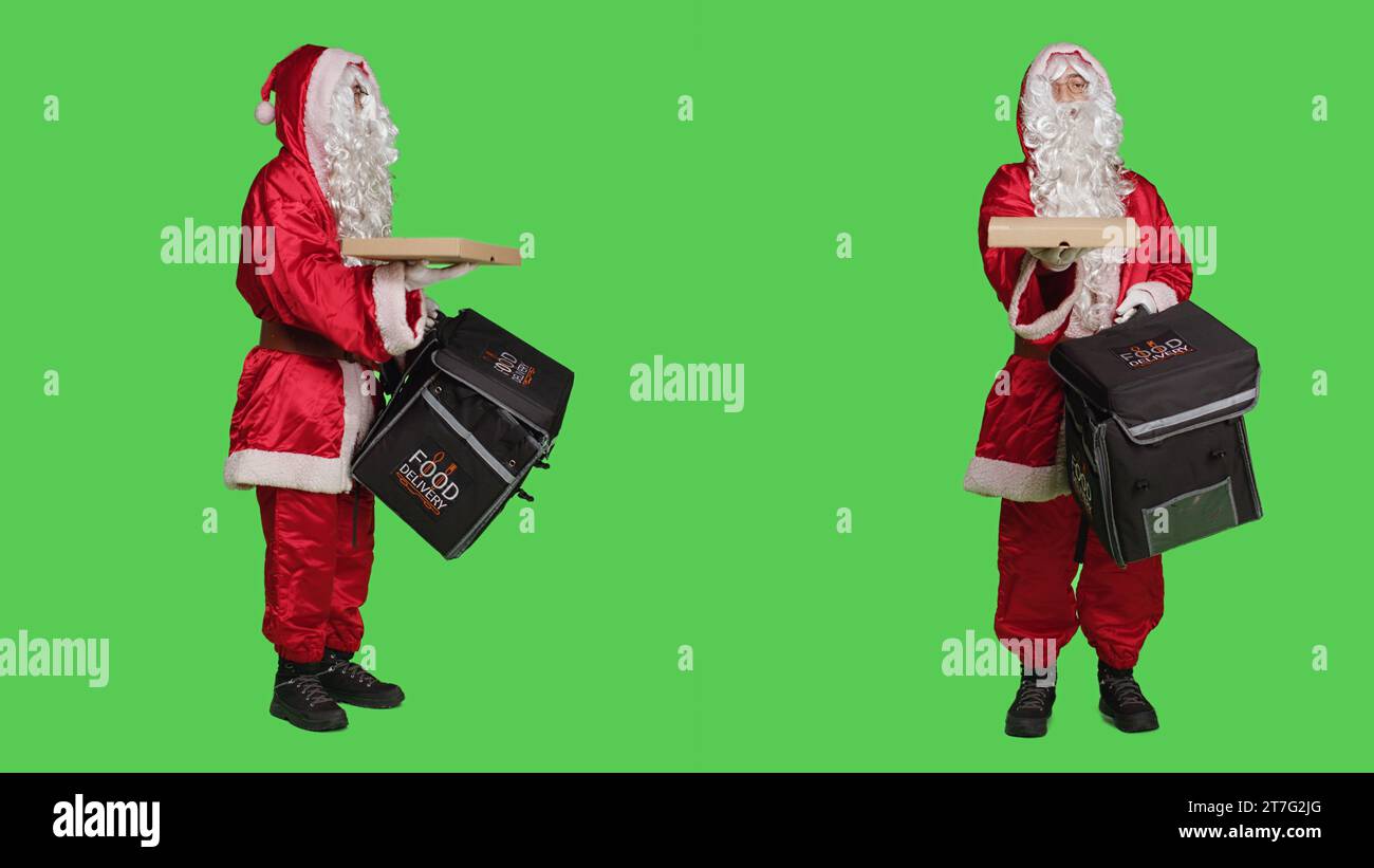 Father christmas costume deliveryman carrying themal backpack with fast ...