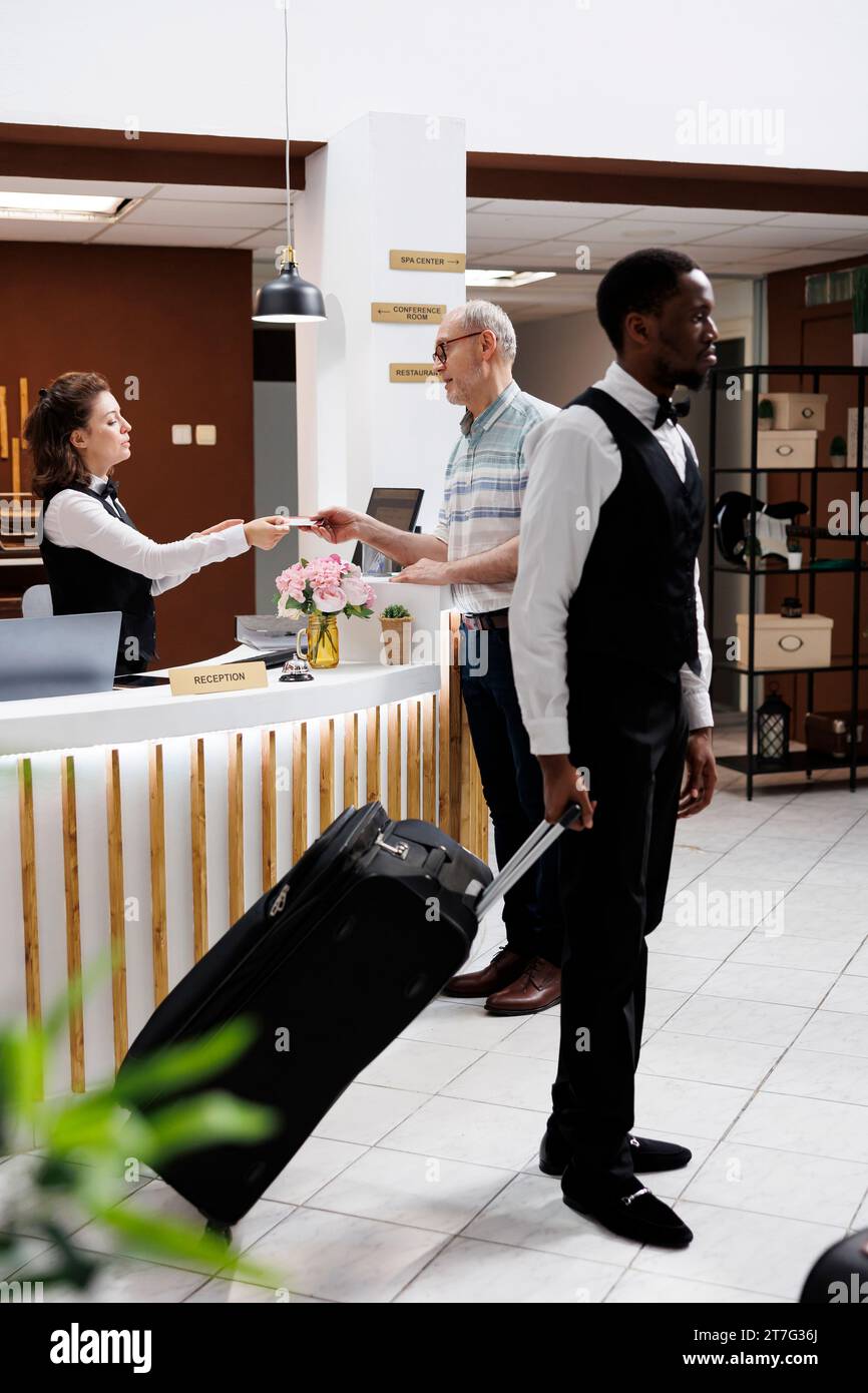 Lobby front reservations check in desk woman female guest hi-res stock ...