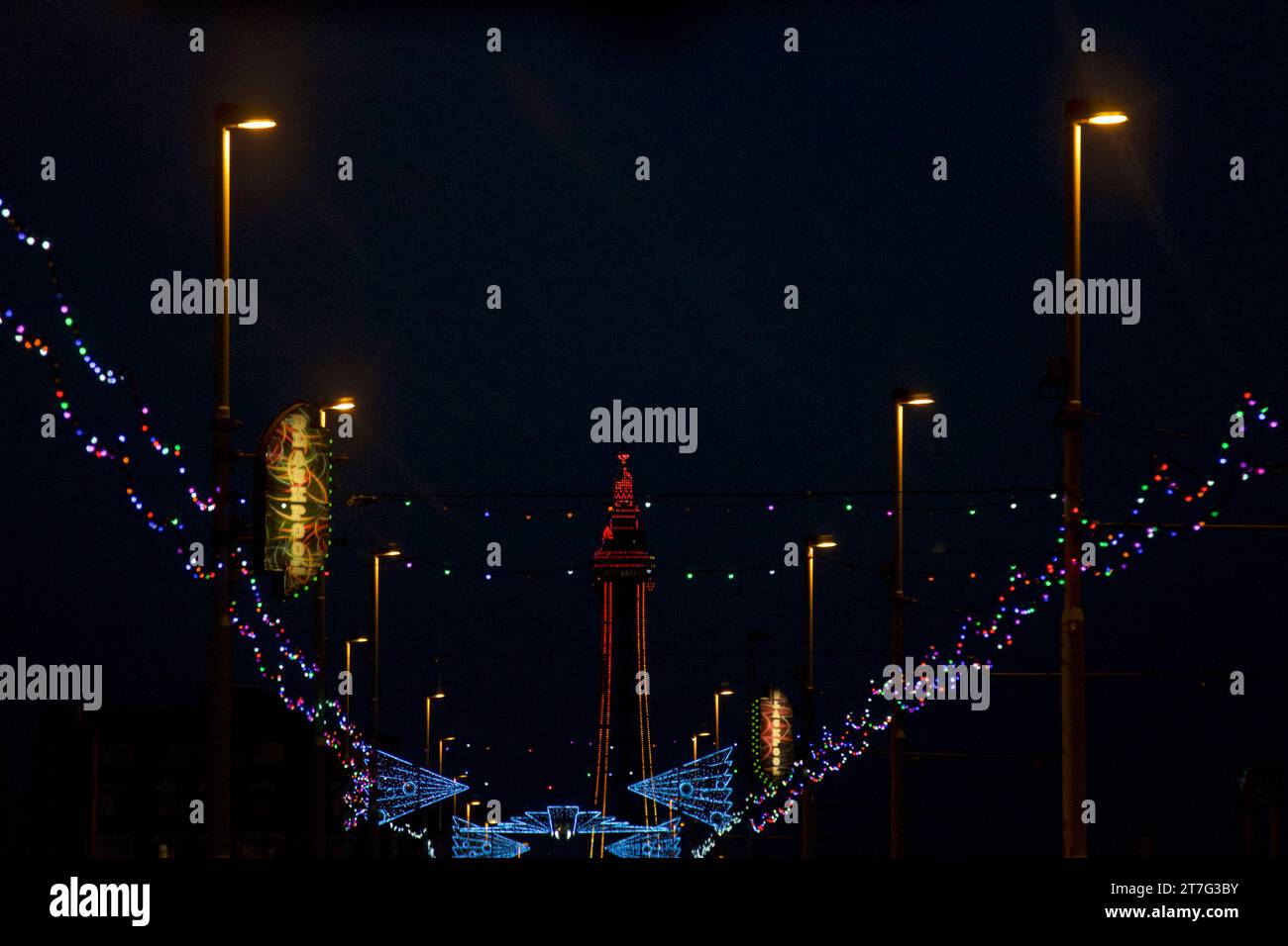 blackpool tower illuminated in red and lights on the streets on display ...