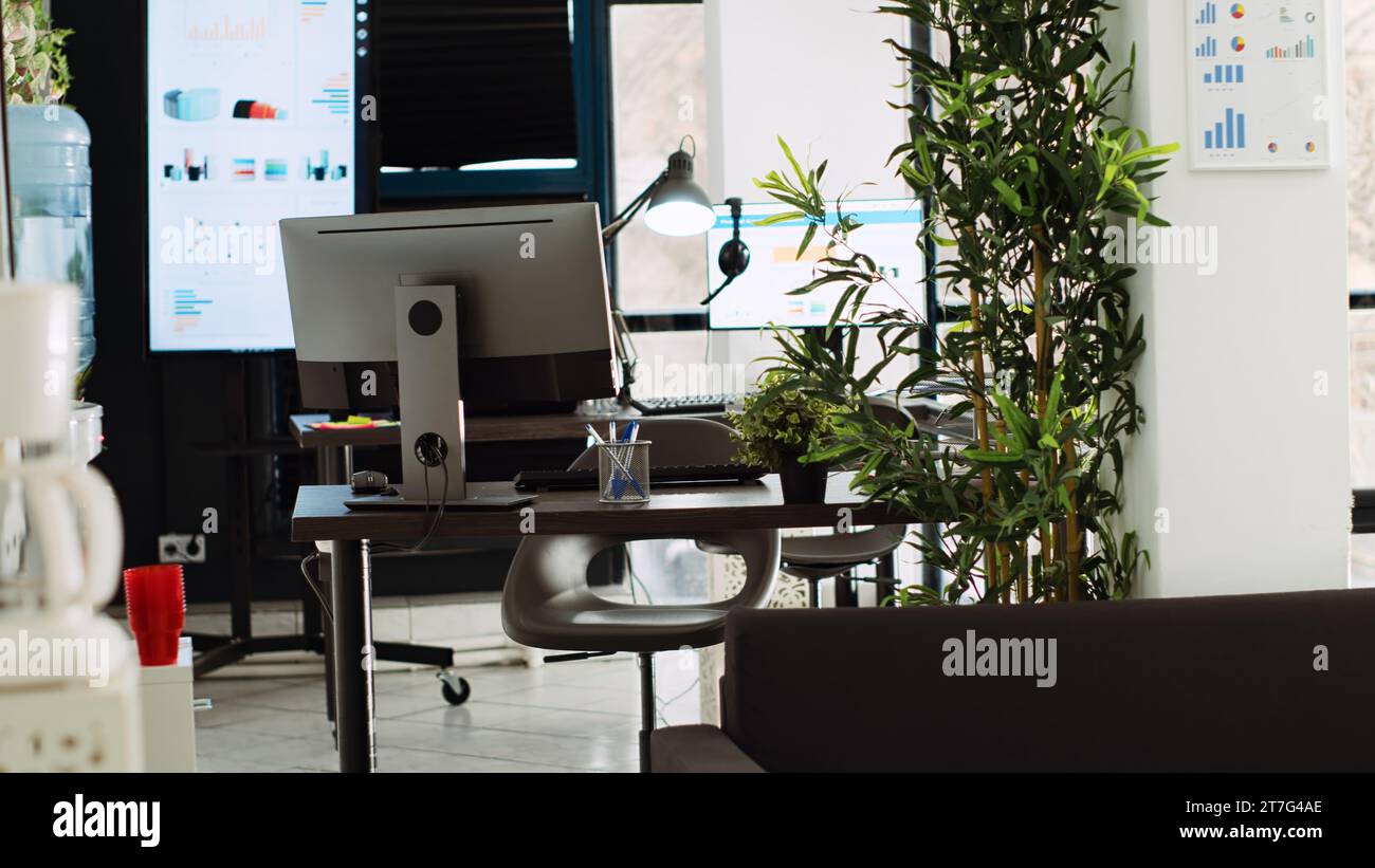 Empty small business open space with desk supplies and company ...