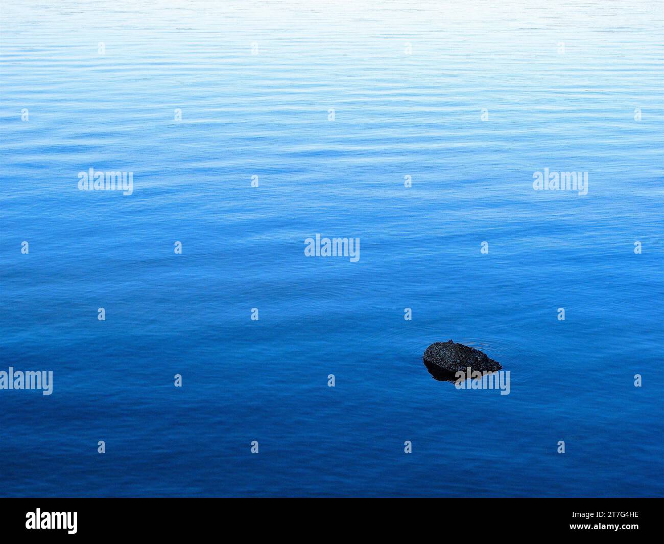 ripples in the blue water of the river clyde in Greenock, Scotland with ...