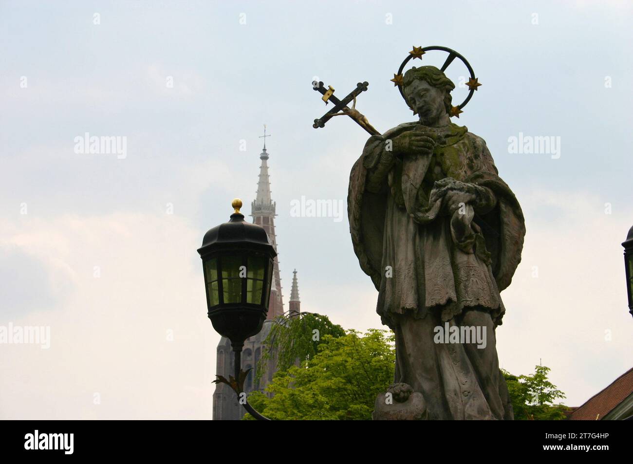 religious stone statue with crucifix and crown of thorns in Brussels in ...