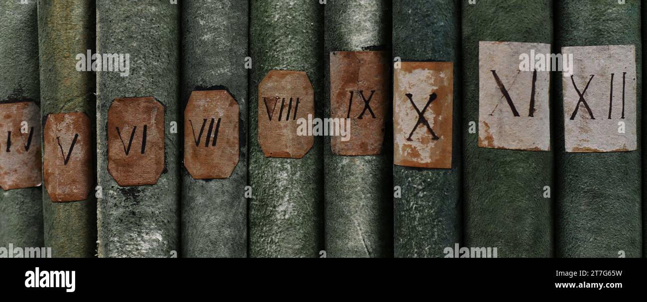 Old books with Roman numerals in the library archive Stock Photo - Alamy