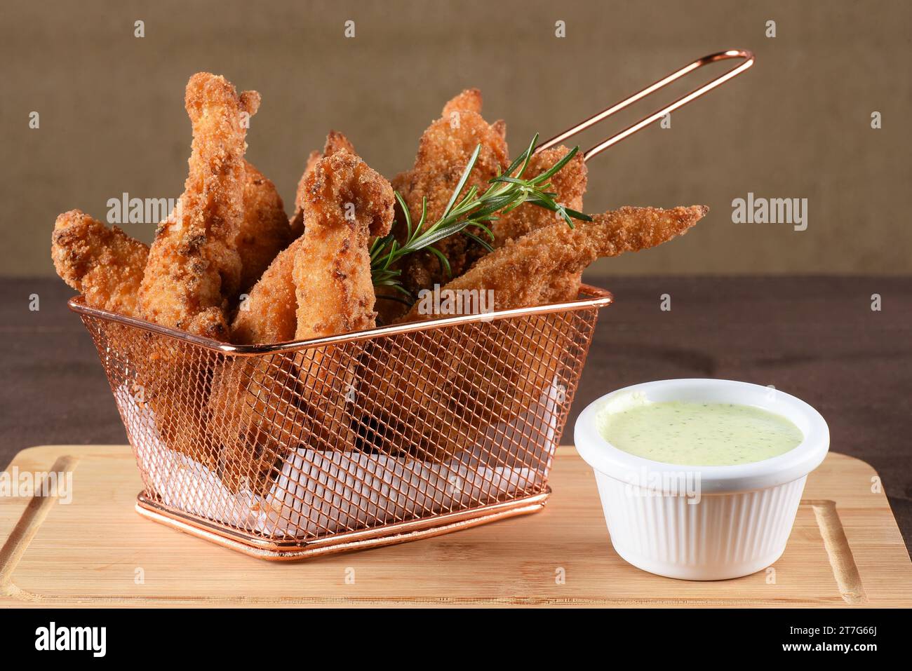 pieces of fried fish breaded with panko flour served with herb sauce ...
