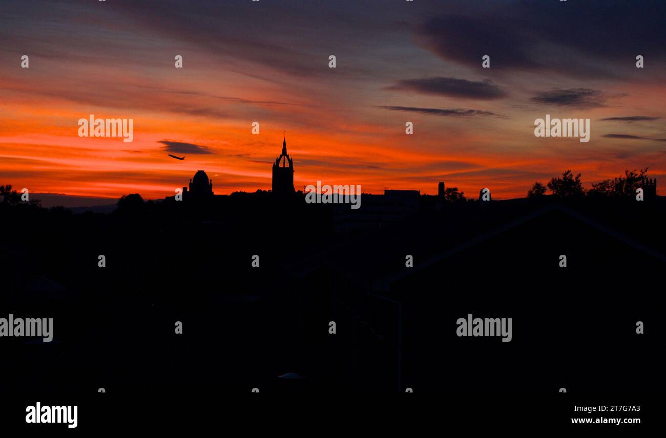 silhouetted panoramic view of paisley with red sky at night showing the ...
