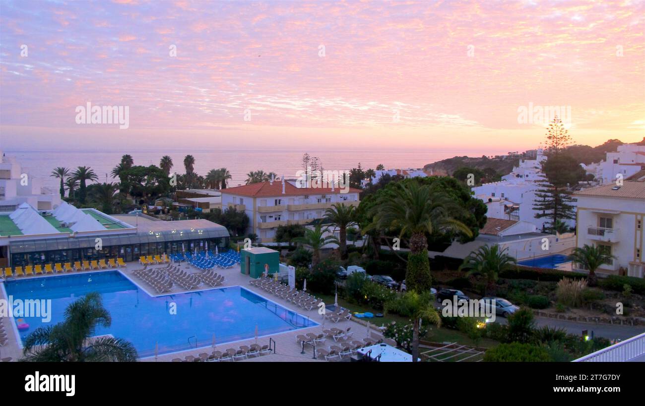 sun going down over the resort in Portugal with swimming pools in view ...