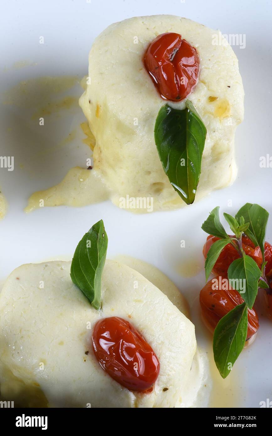 tasty rondelli pasta and cannelloni in white sauce with parmesan cheese ...