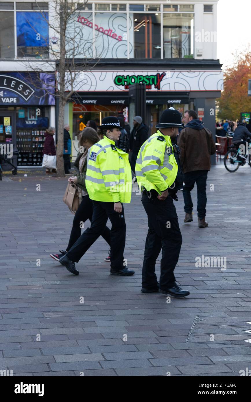 Community friendly police officers walking Stock Photo - Alamy