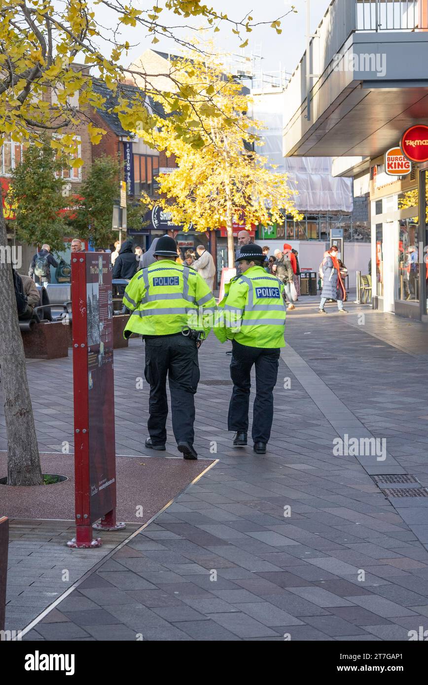 Community friendly police officers walking Stock Photo - Alamy