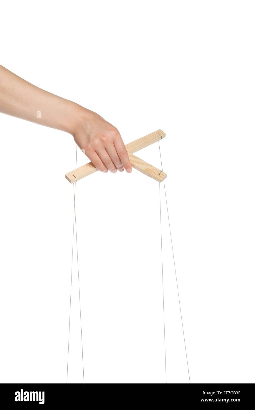 Woman pulling strings of puppet on white background, closeup Stock ...