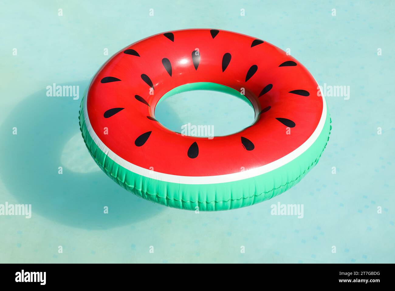 Inflatable ring floating on water in above ground swimming pool ...