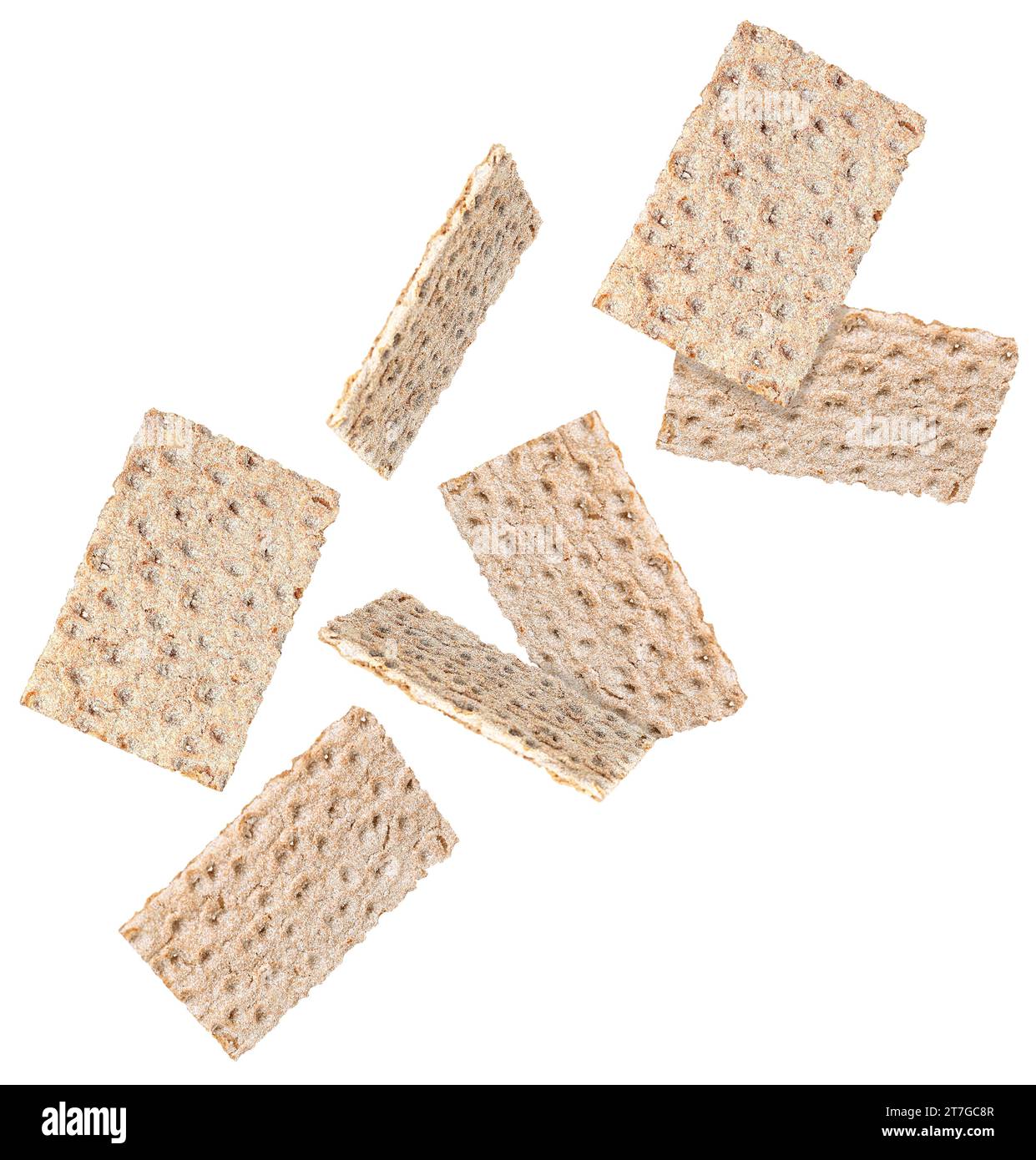 Many tasty crispbreads falling on white background Stock Photo - Alamy