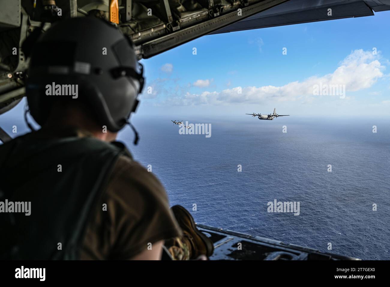 A 41st Airlift Squadron loadmaster watches a C-130J Super Hercules ...
