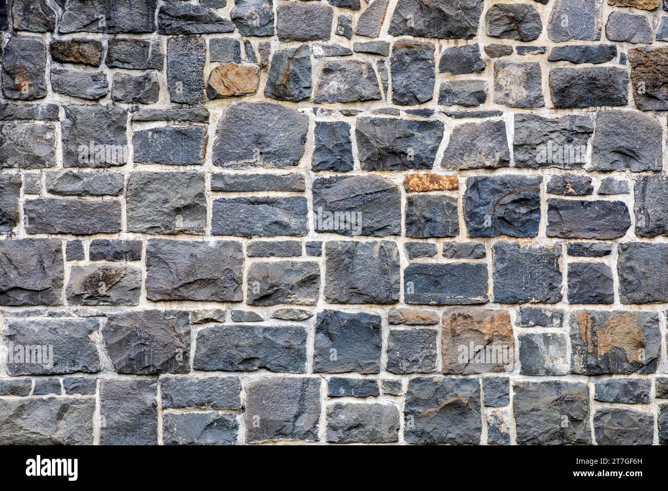 a chunky brick wall made from big blocks of stone Stock Photo - Alamy